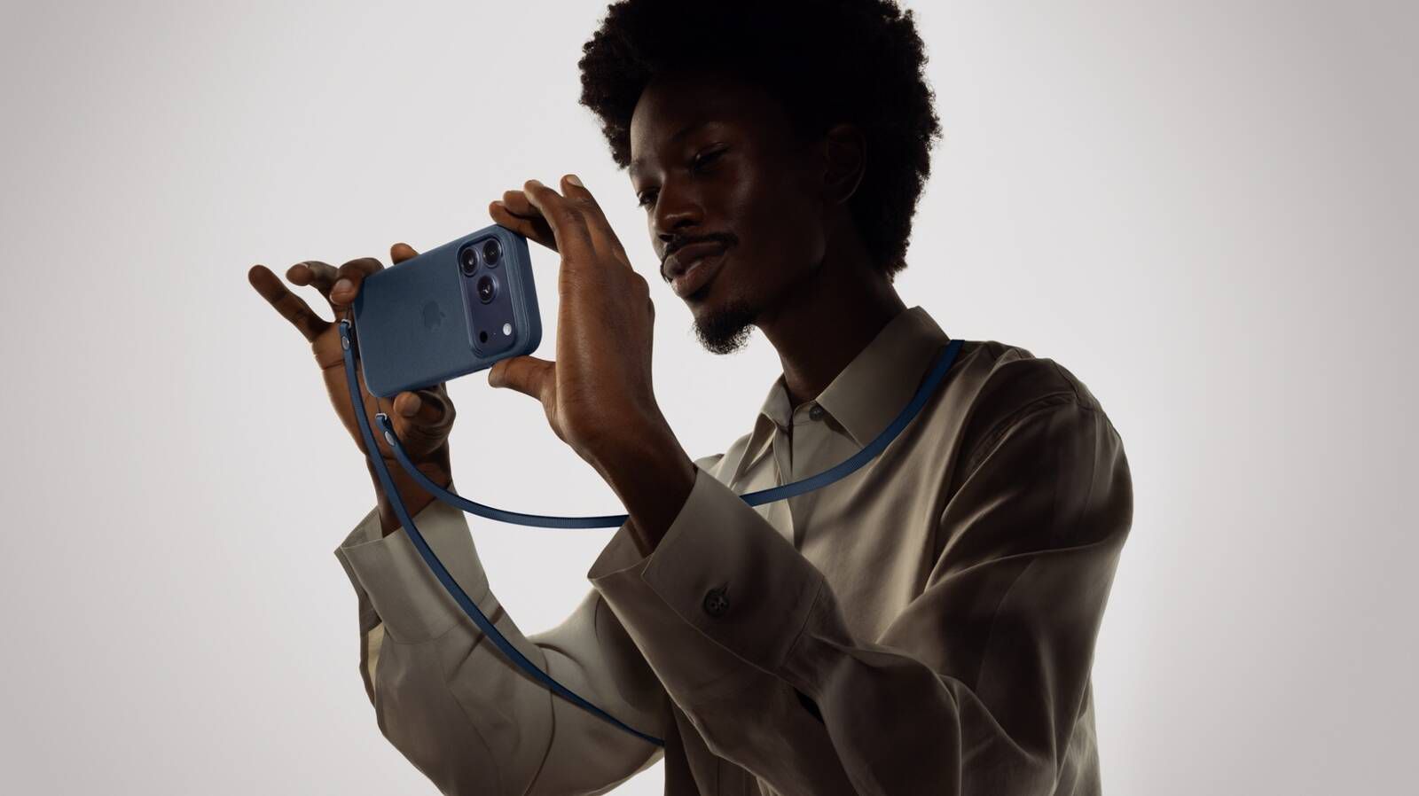 Apple Unveils Crossbody Strap and TechWoven Case for iPhone 17 Pro - MacRumors